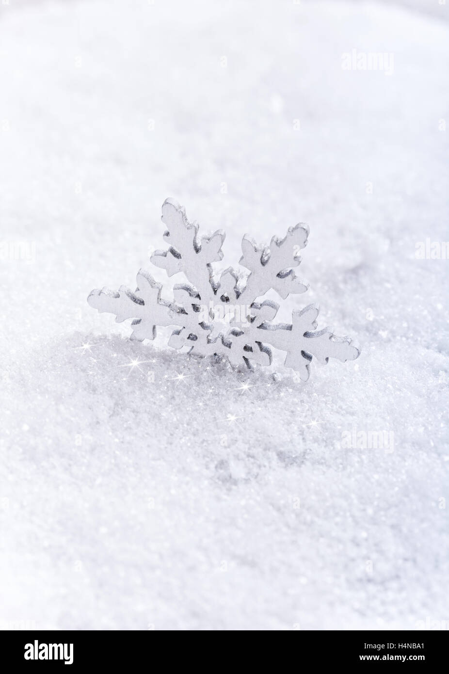 Snowflakes on snow, winter background Stock Photo - Alamy