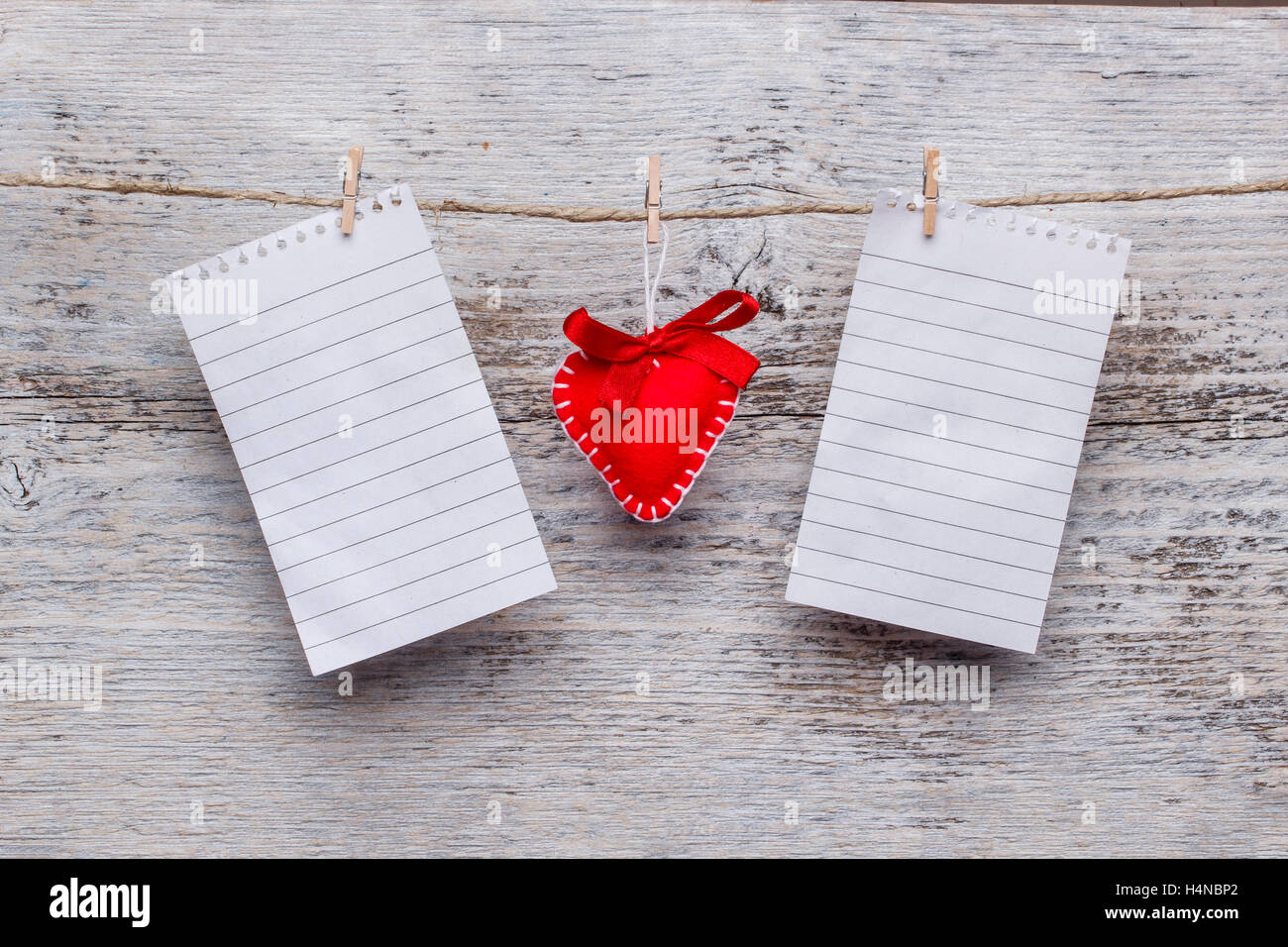 Decorative heart with note paper hanging on the rope Stock Photo - Alamy