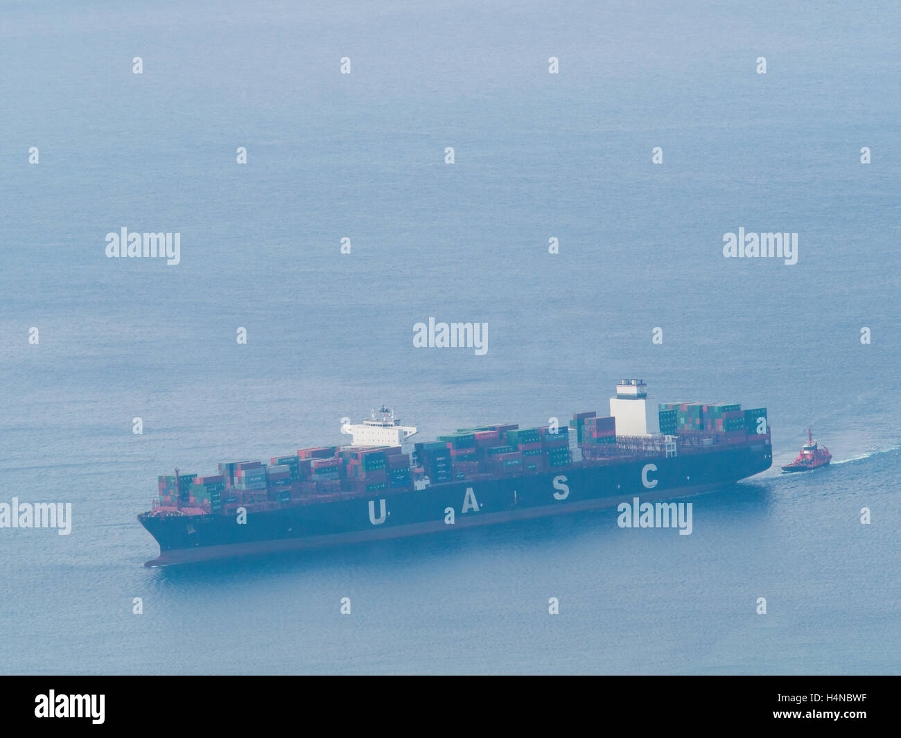 Big Cargo freight ship full of container arriving next to the port with ...