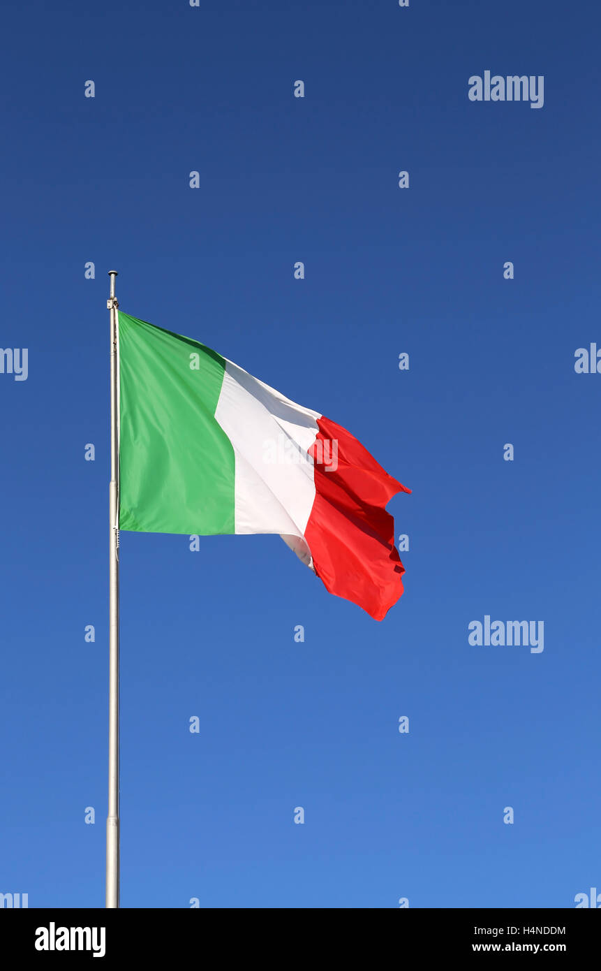 big Italian flag waving in the blue sky without clouds Stock Photo - Alamy