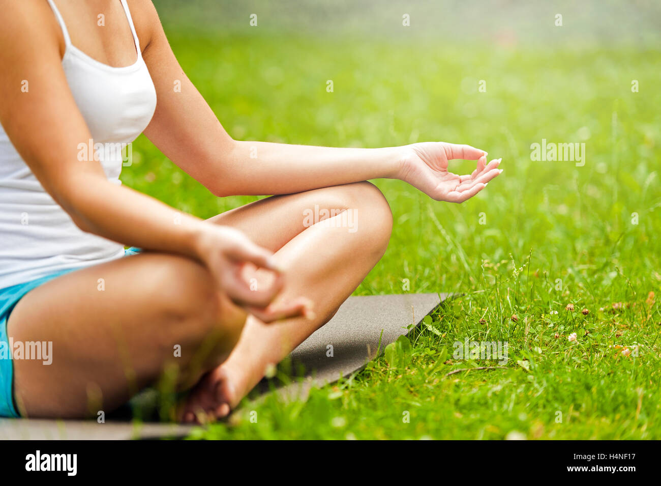 In the lotus posture close up Stock Photo - Alamy