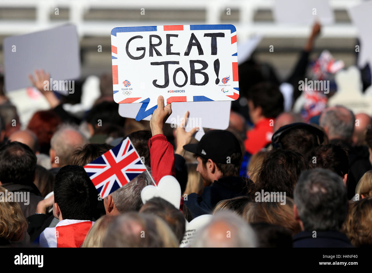 Fans hold up a sign showing support during the Olympic and Paralympic ...