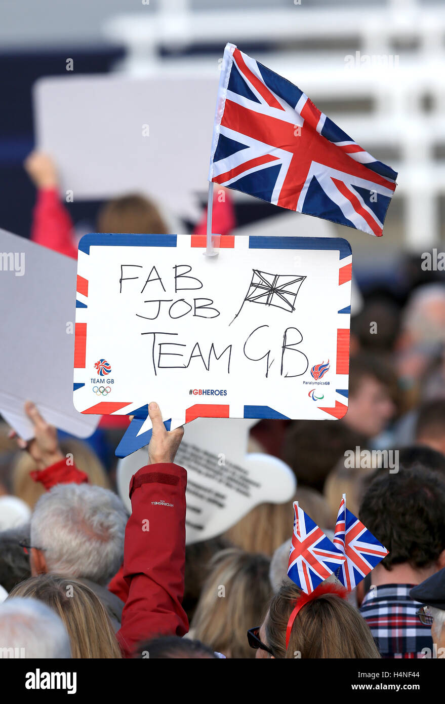 Fans hold up a sign showing support during the Olympic and Paralympic ...