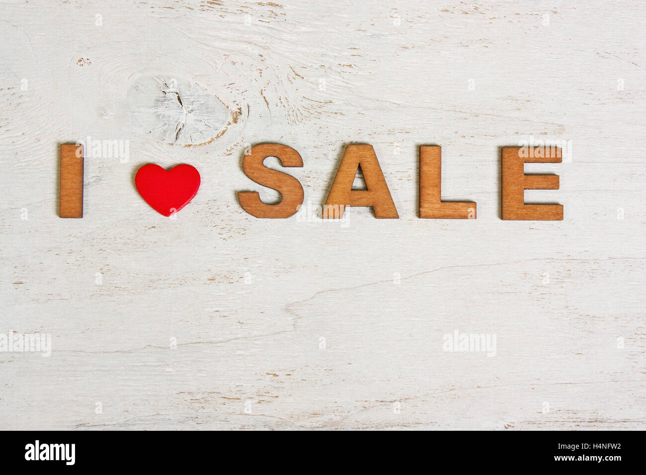 I love sales of wooden letters on a white background old wooden Stock ...