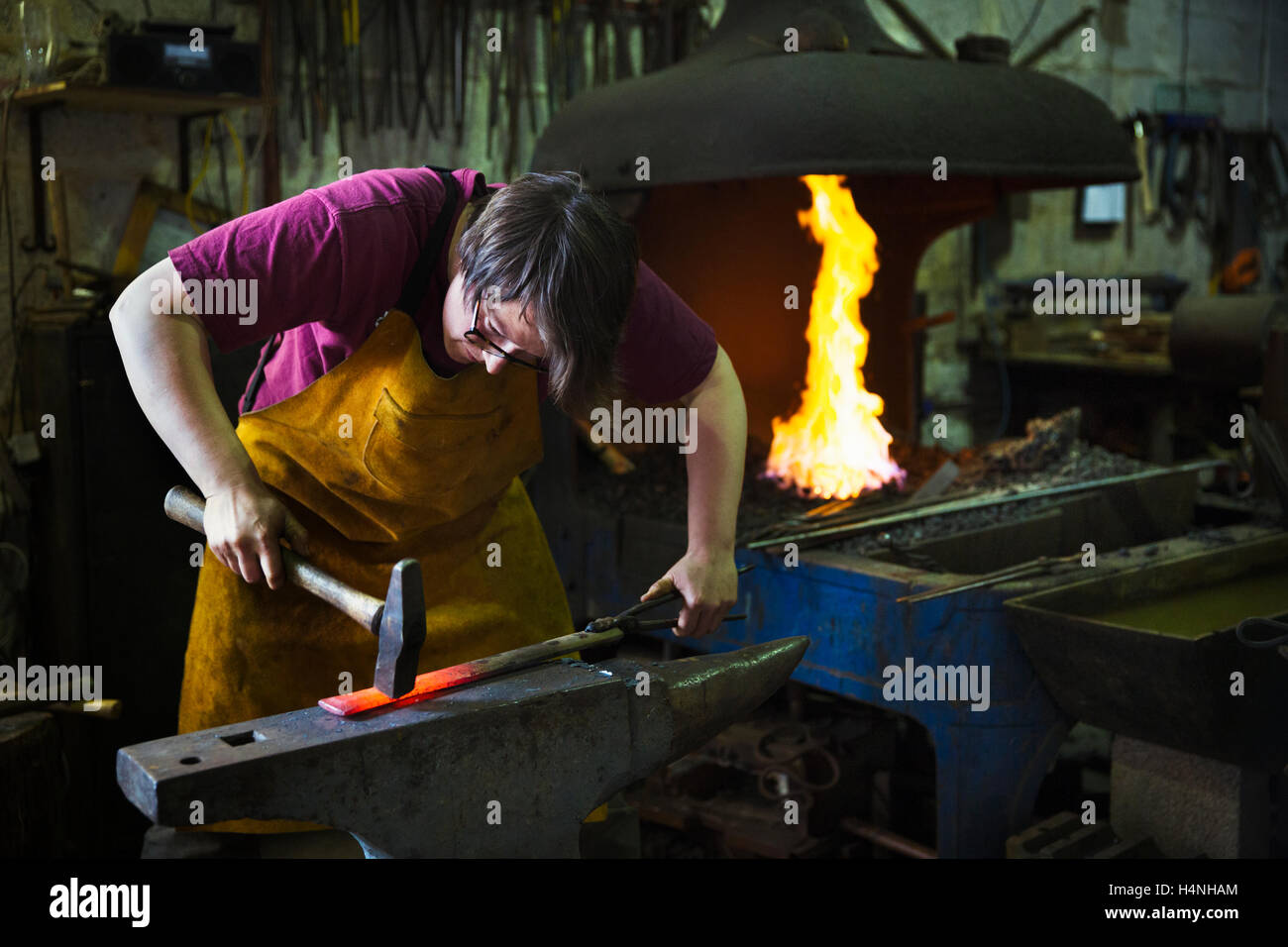 Woman working as blacksmith hi-res stock photography and images - Alamy