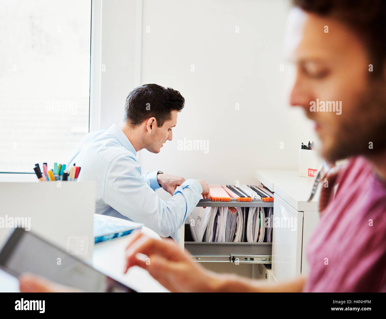 Man looking through files in hi-res stock photography and images - Alamy