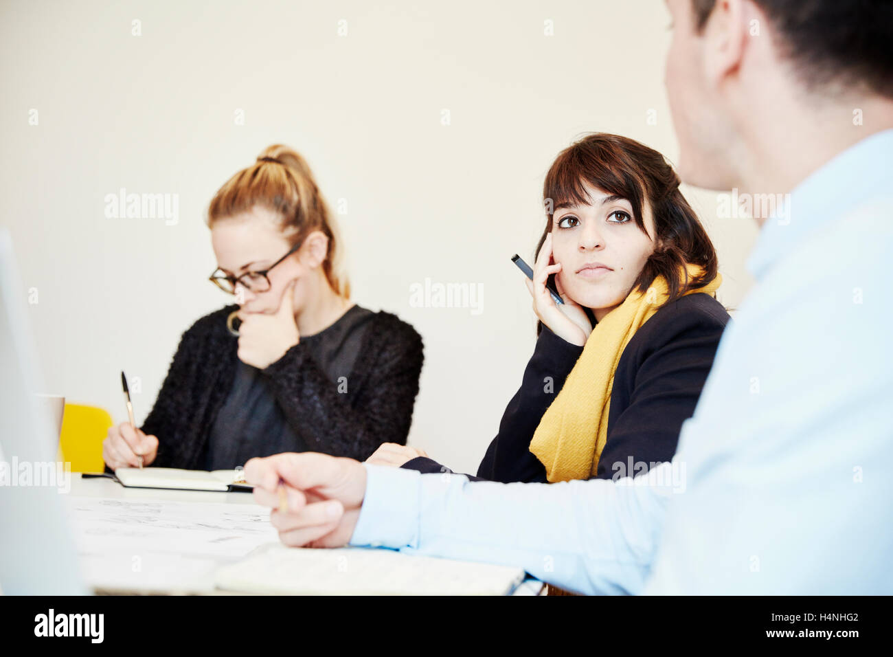Side view of a woman seated looking up hi-res stock photography and ...