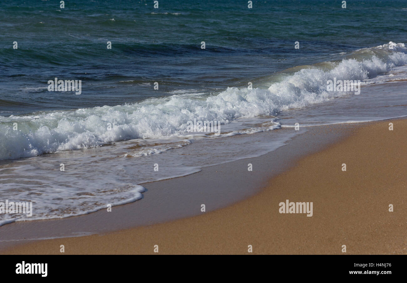 Wave of the sea on the sand beach Stock Photo - Alamy