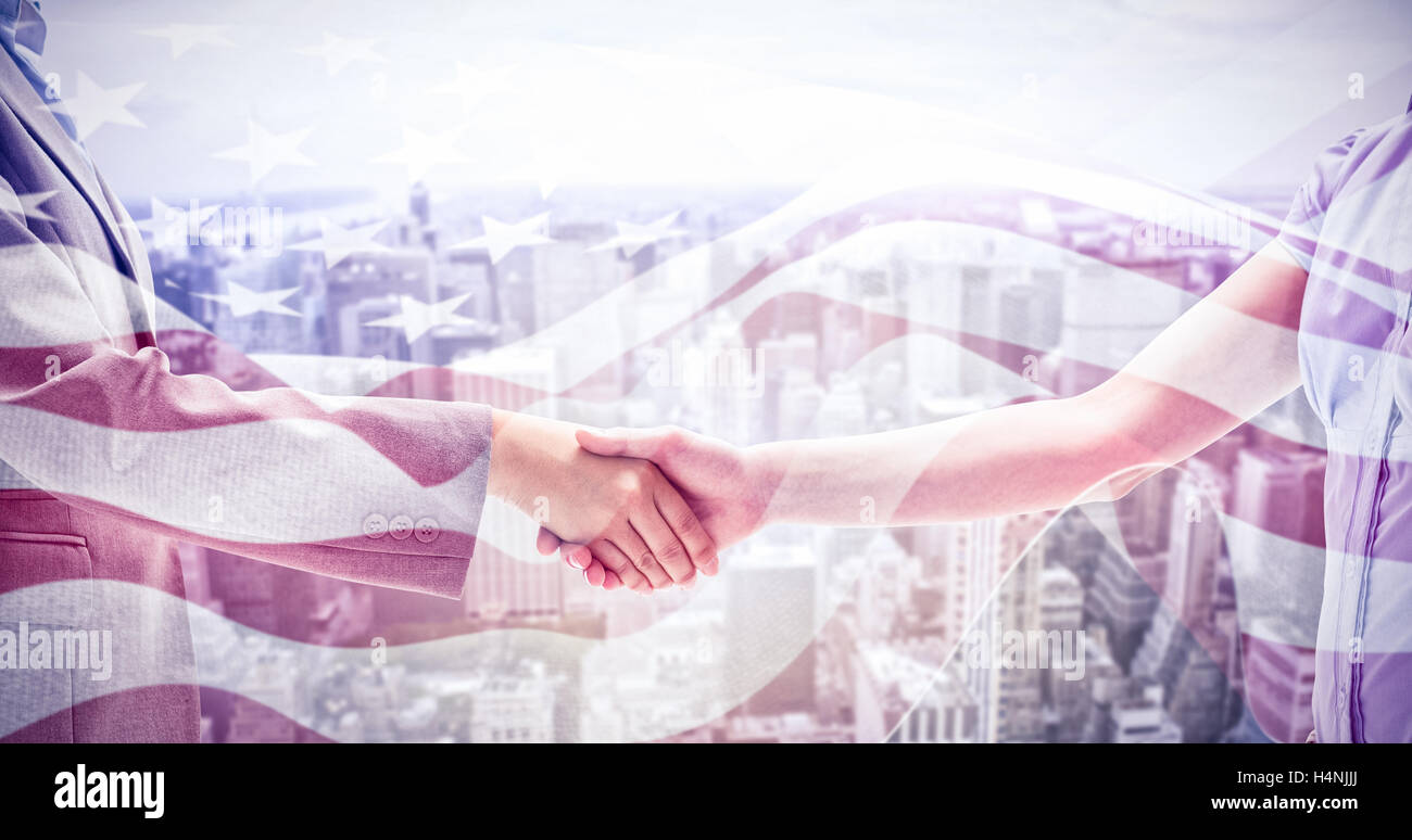 Composite image of handshake between two women Stock Photo - Alamy