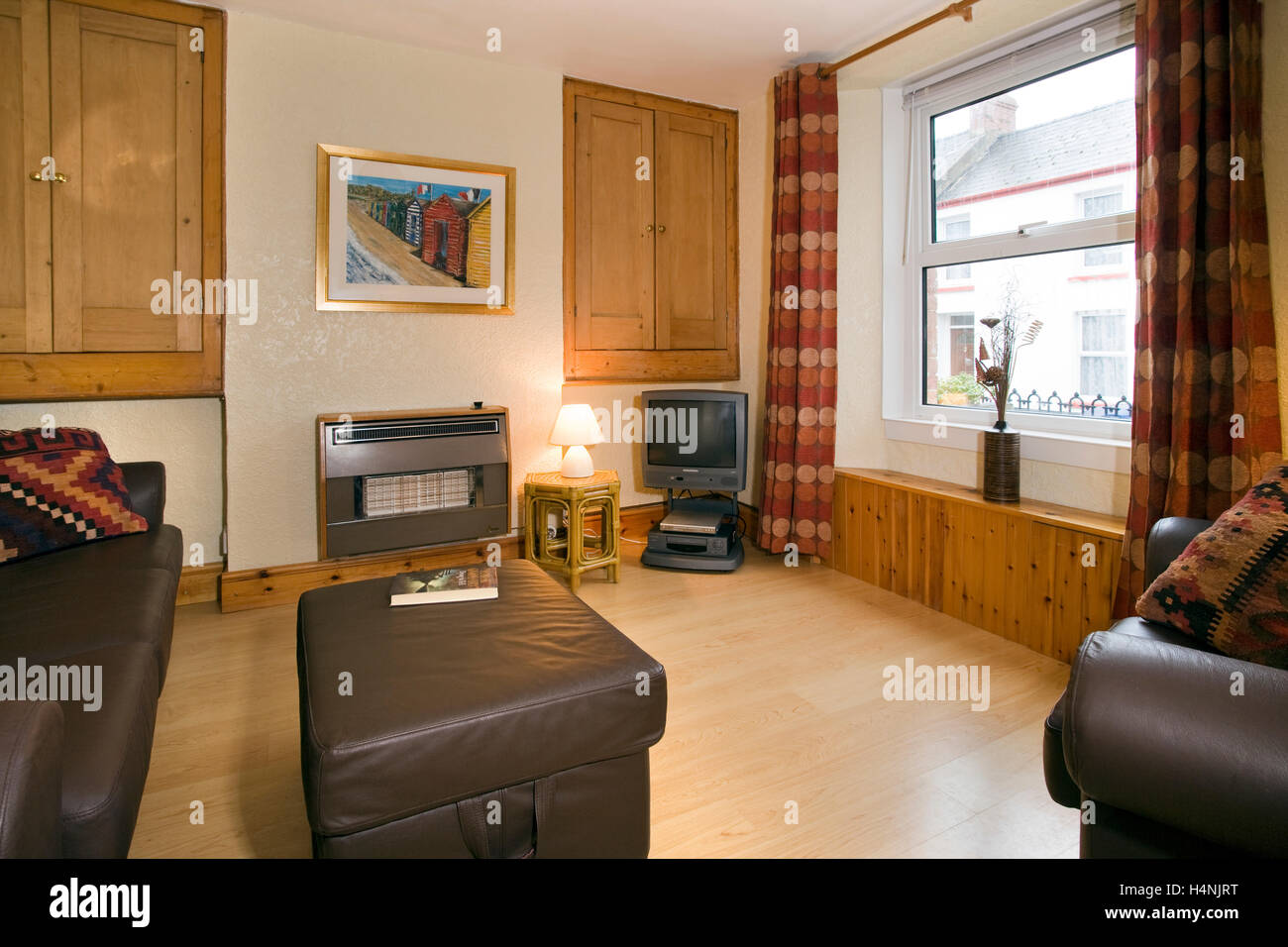 Old fashioned gas fire back boiler in a lounge Stock Photo - Alamy