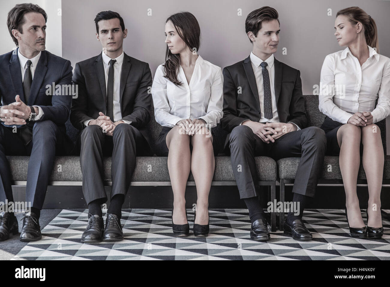 Business people waiting for job interview sitting in a row Stock Photo ...