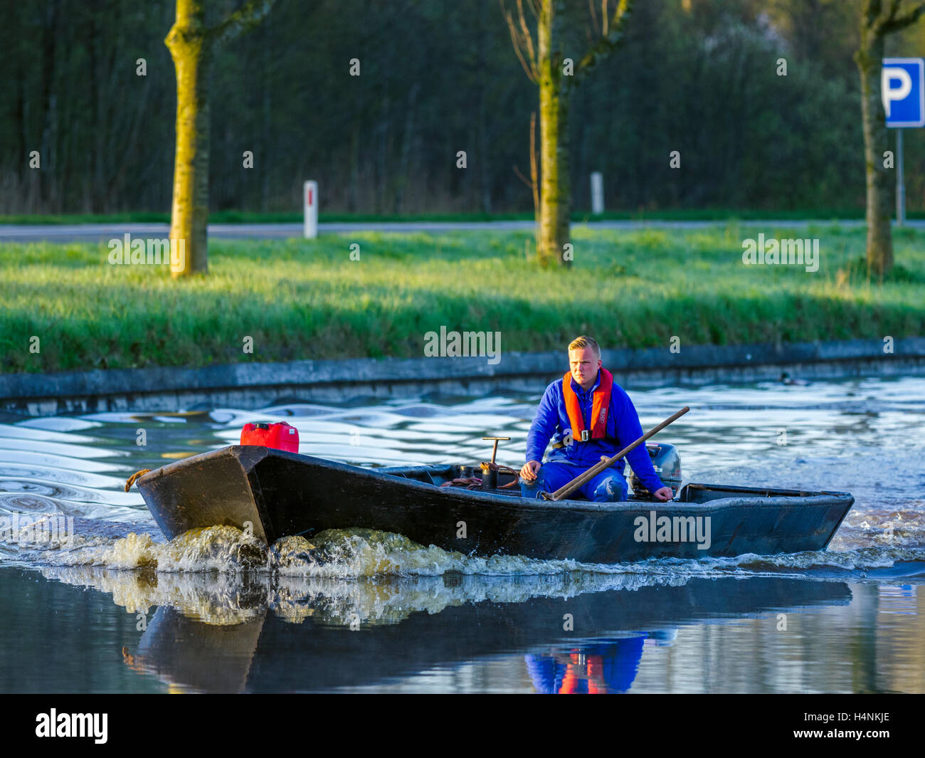 Power boat on canal, Netherlands Stock Photo - Alamy