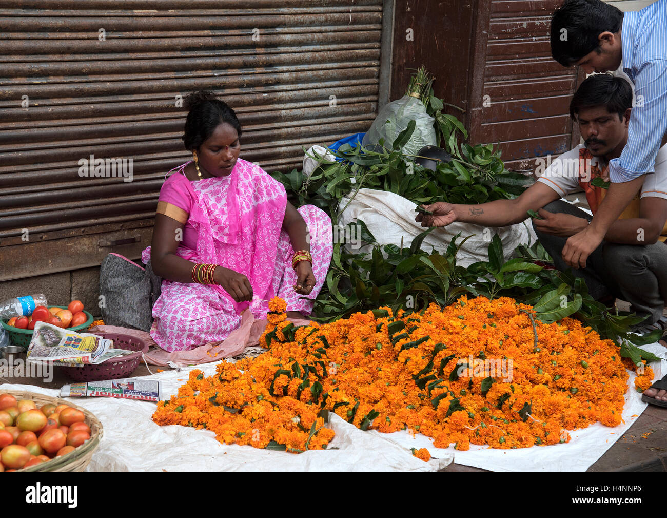 Indian woman selling flowers hi-res stock photography and images - Alamy