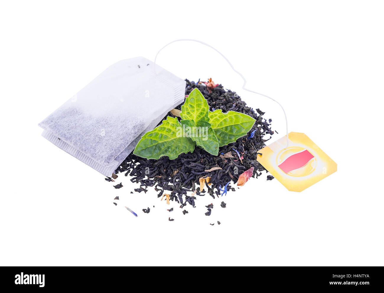Leaf tea and tea a packet on a white background Stock Photo - Alamy
