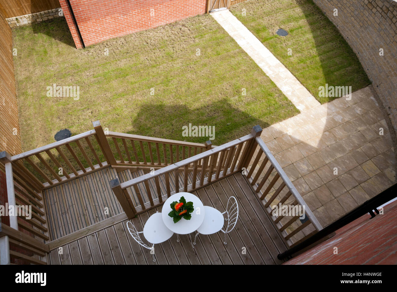 Looking down on a property development garden and decked balcony ...