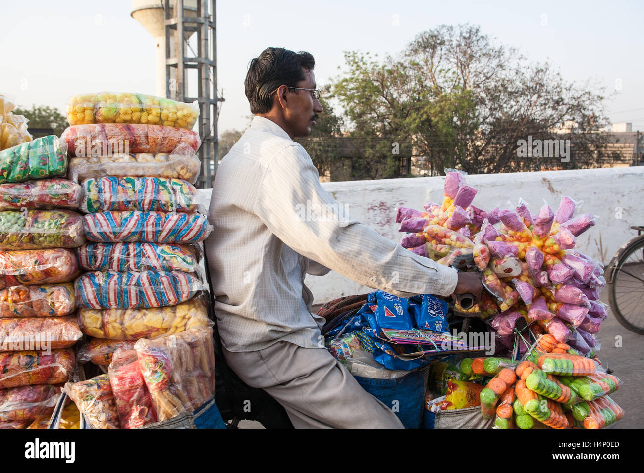 Bicycle loaded down with snacks in centre of Ahmedabad, Gujurat state ...