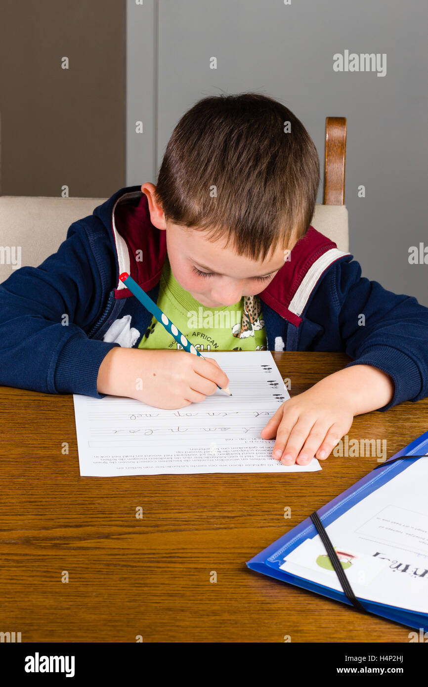 Boy doing homework Stock Photo - Alamy