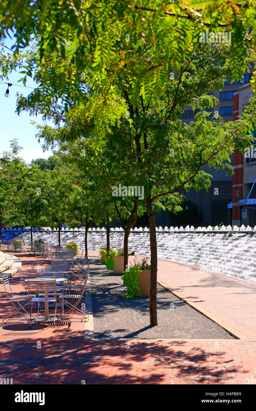 The waterfall, trees and picnic area in Triangle Park in downtown ...