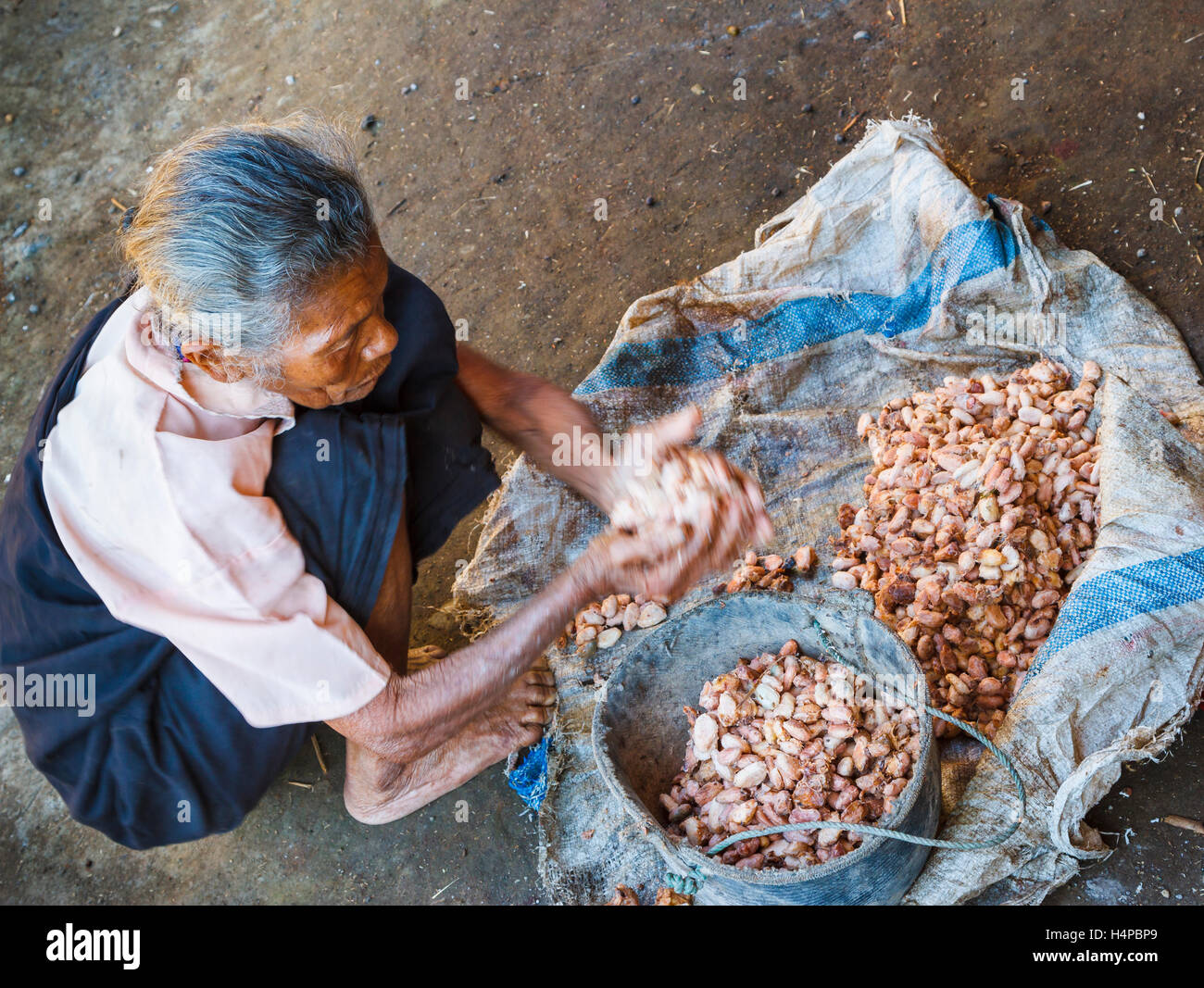 Old woman working Stock Photo - Alamy