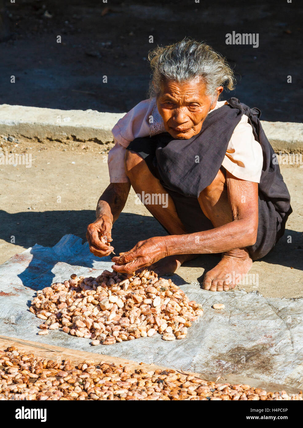 Old woman working Stock Photo - Alamy