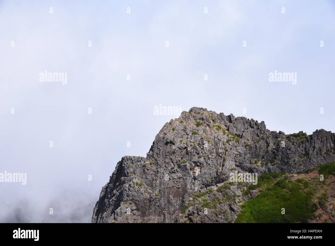 Rock formation disappearing into cloud Stock Photo - Alamy