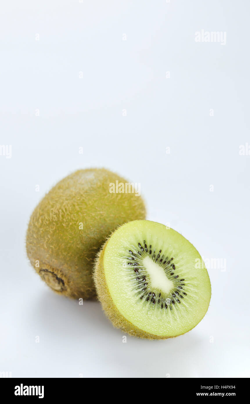 delicious whole kiwi fruit and half on white background Stock Photo - Alamy