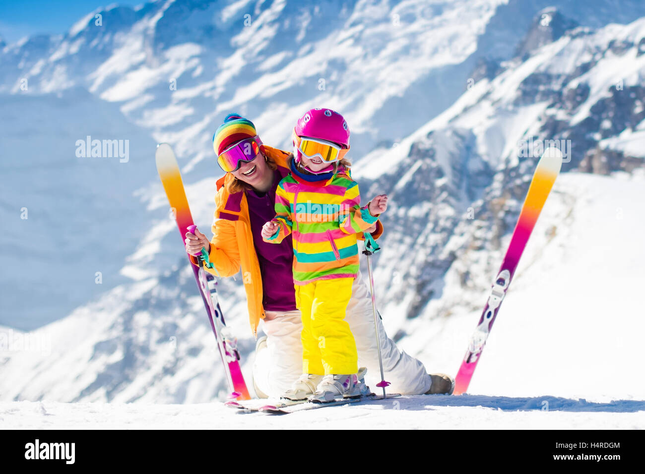 Family ski vacation. Group of skiers in Swiss Alps mountains. Mother ...