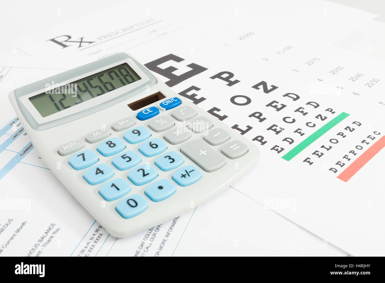Eyesight test form with calculator and prescription form near it Stock ...