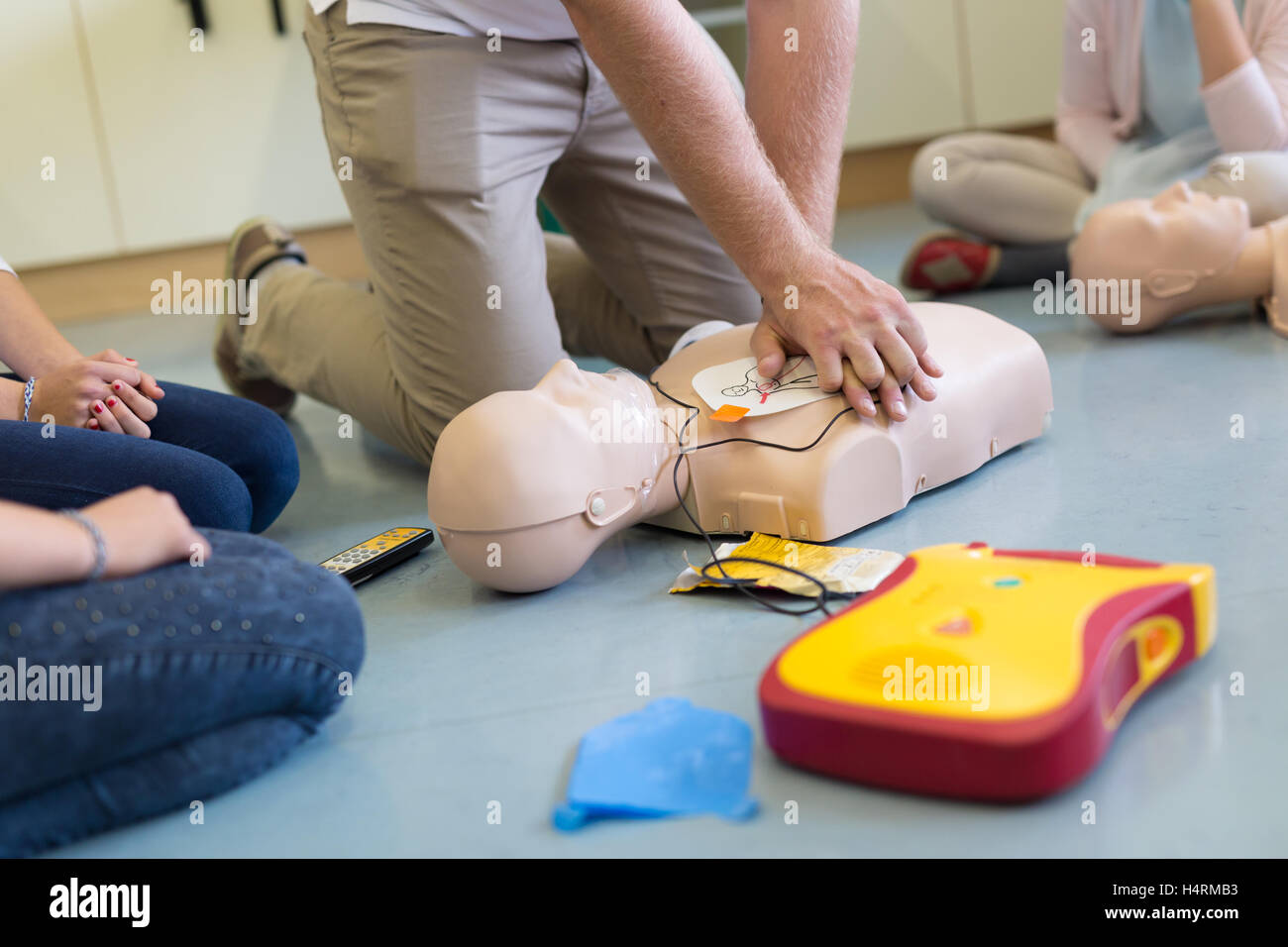 First aid resuscitation course using AED Stock Photo - Alamy