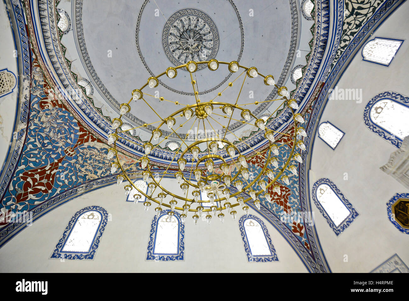 Mustafa Pasha Mosque. Wide angle view of ceiling and golden lamp ...