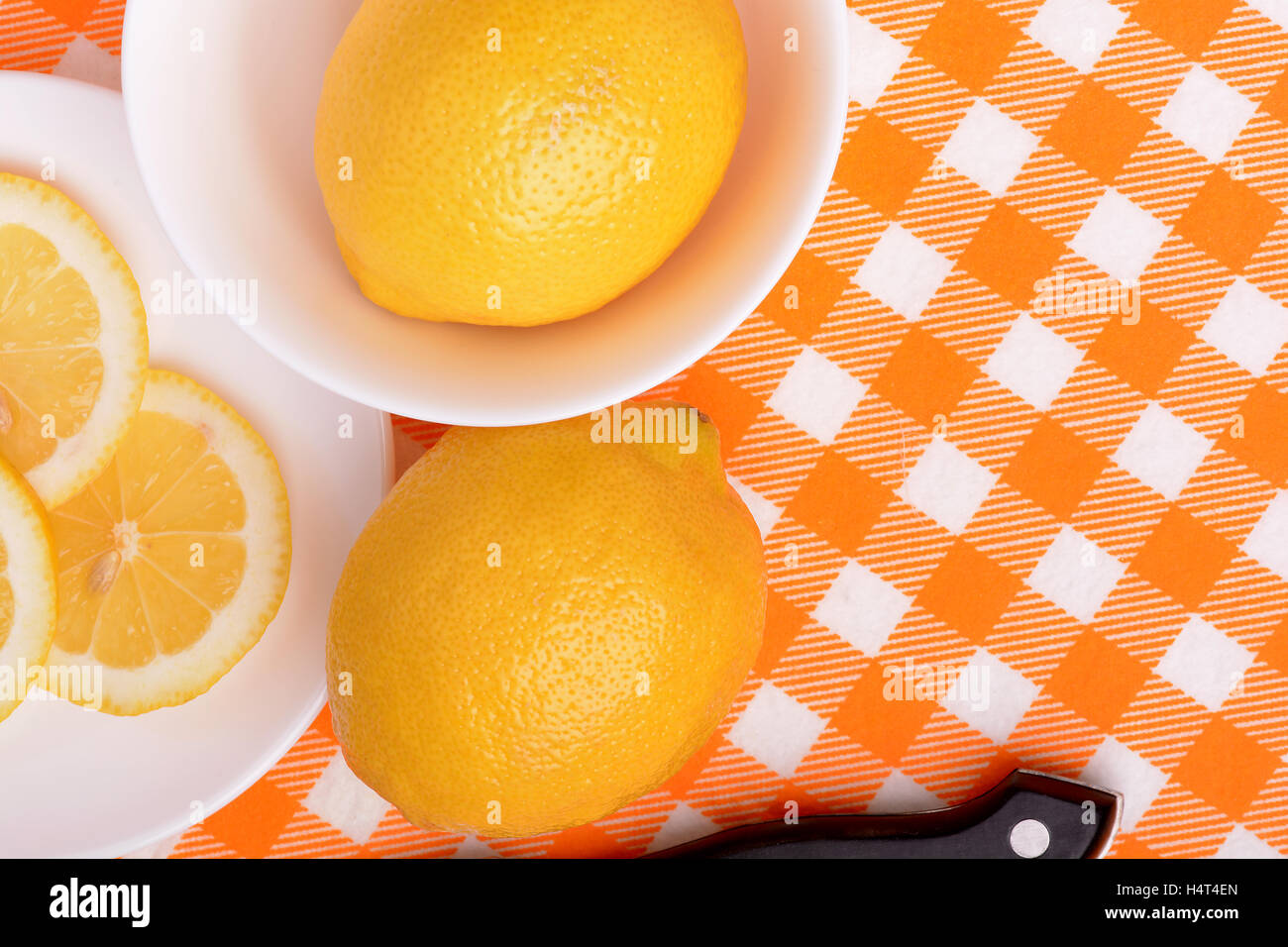 A slices of fresh yellow lemon. Lemon pieces in different sizes ...