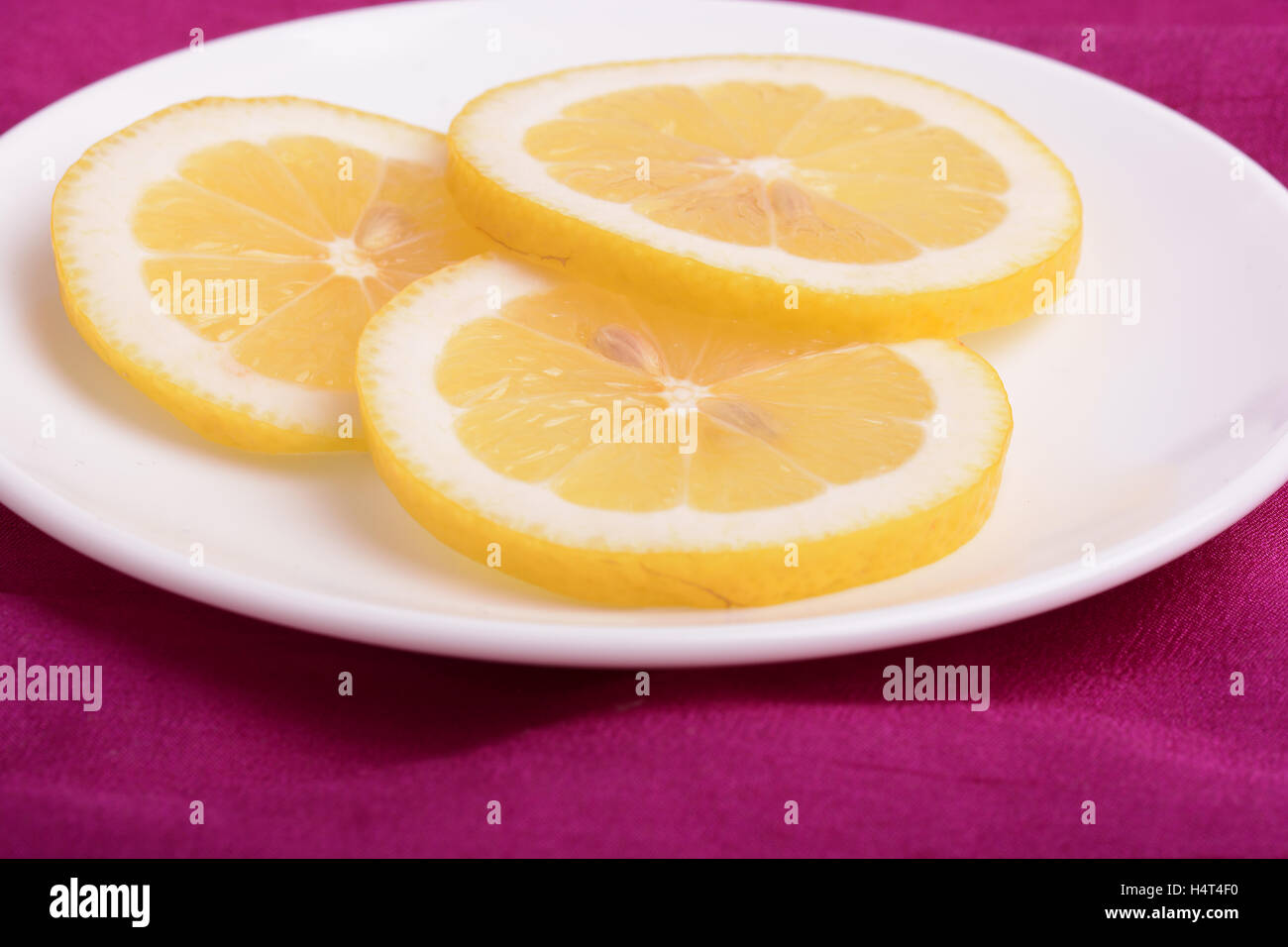 A slices of fresh yellow lemon. Lemon pieces in different sizes ...