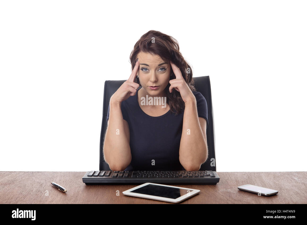businesswoman sitting at desk looking confused Stock Photo - Alamy
