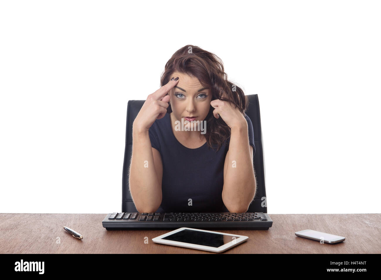 businesswoman sitting at desk looking confused Stock Photo - Alamy