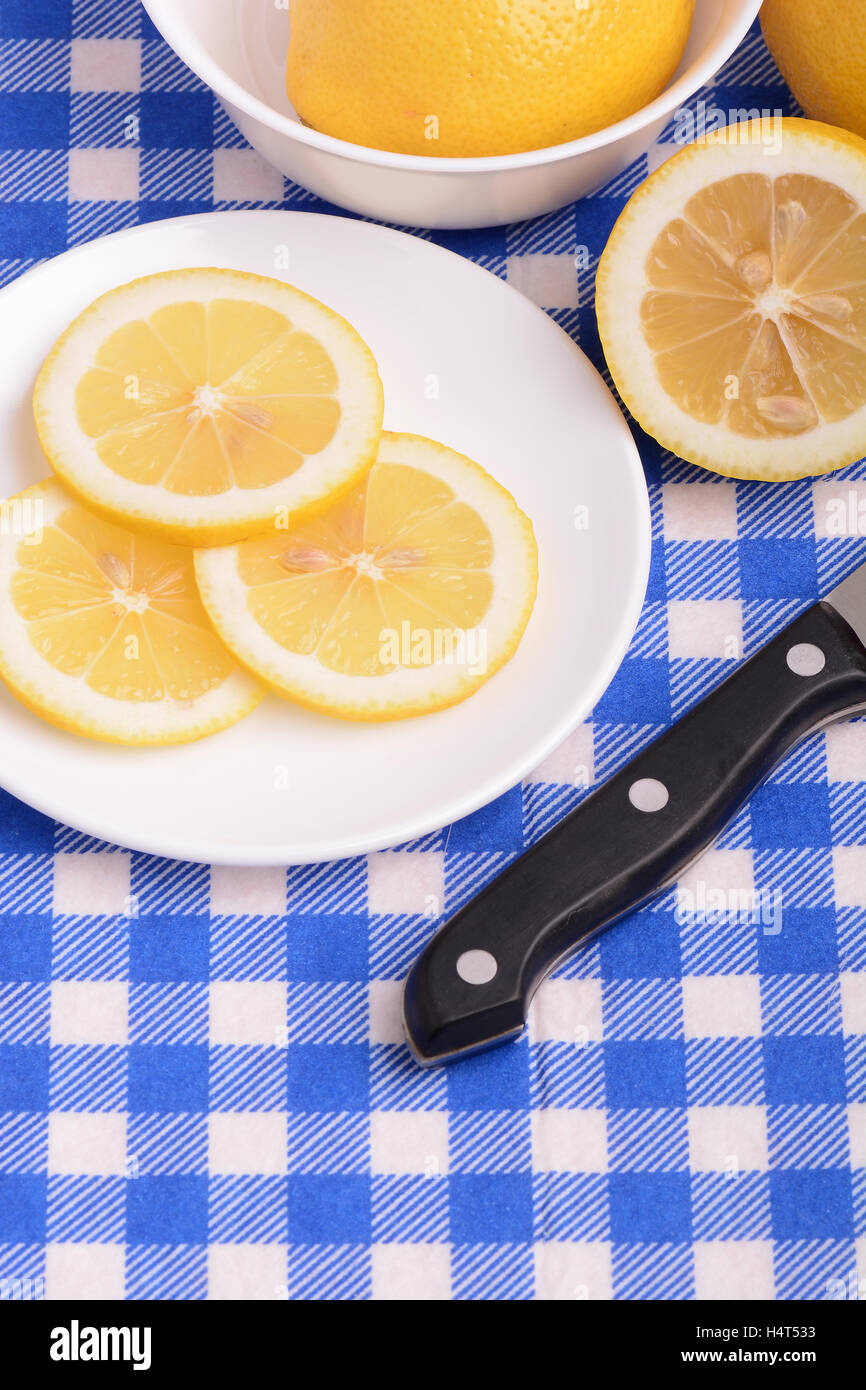 A slices of fresh yellow lemon. Lemon pieces in different sizes ...