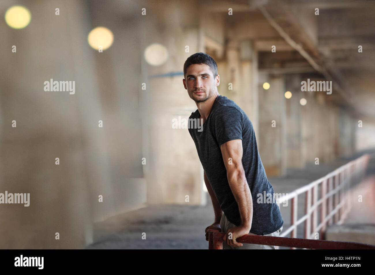 Young man jumping over railing hi-res stock photography and images - Alamy
