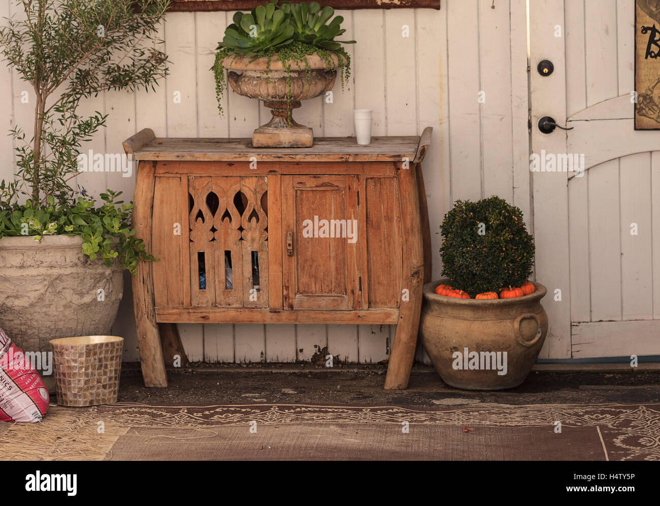 Rustic garden potting table in an outside living area with a decorative ...
