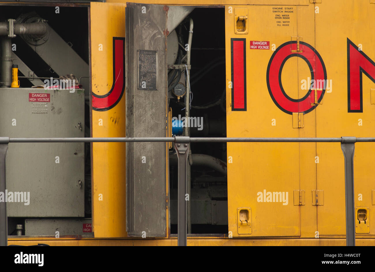 A Union Pacific diesel locomotive's doors are open during maintenance ...