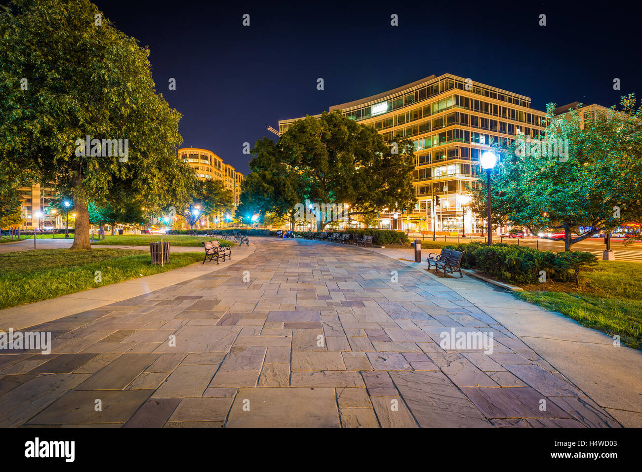 Benches and walkway at night, at Washington Circle, in Washington, DC ...