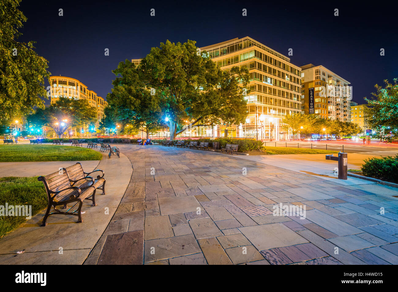 Benches and walkway at night, at Washington Circle, in Washington, DC ...