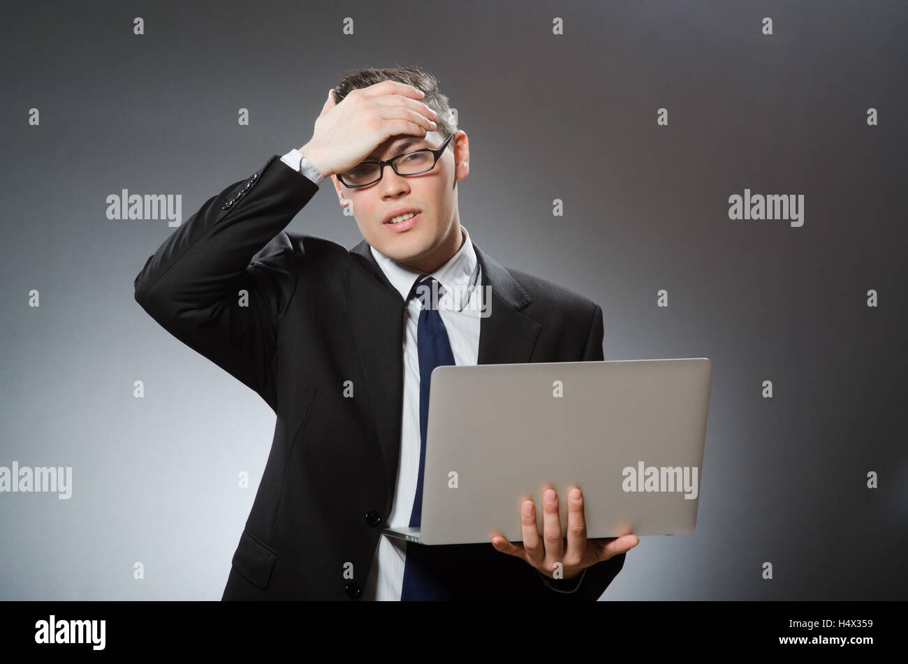 Man with laptop in business concept Stock Photo - Alamy