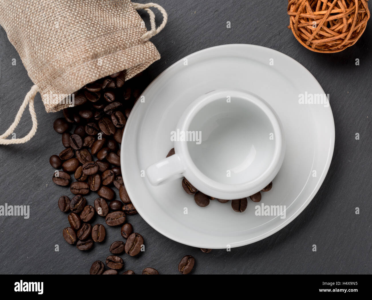Heap coffe beans and cup of fresh coffee Stock Photo - Alamy