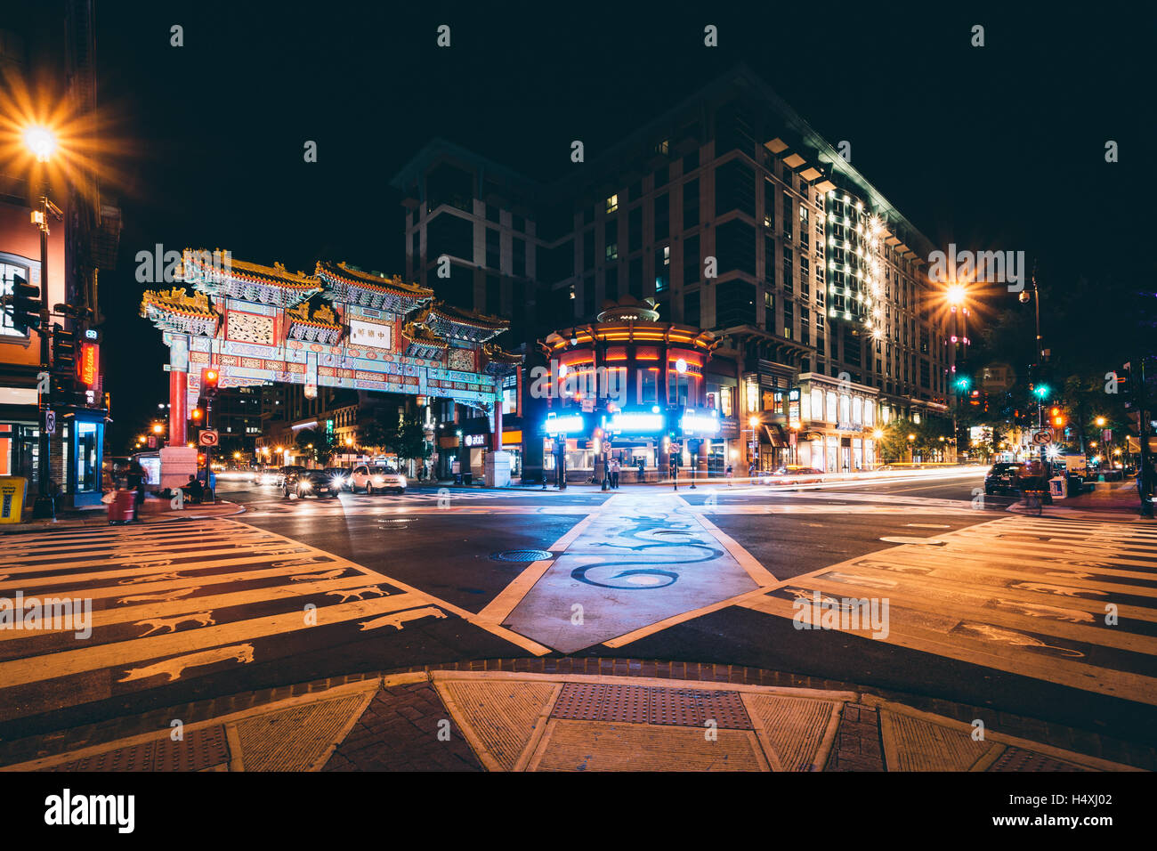 Intersection and the Chinatown Arch at night, in Washington, DC Stock ...