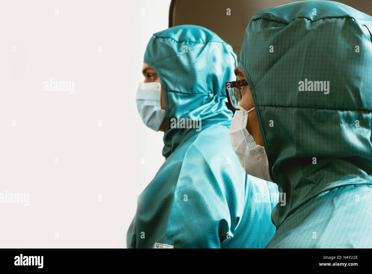Scientist two protective suit isolated Stock Photo - Alamy