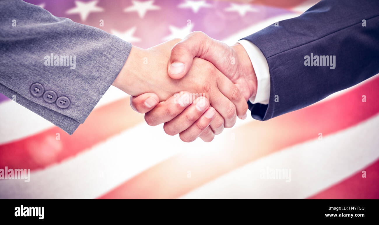 Composite image of handshake between two business people Stock Photo ...