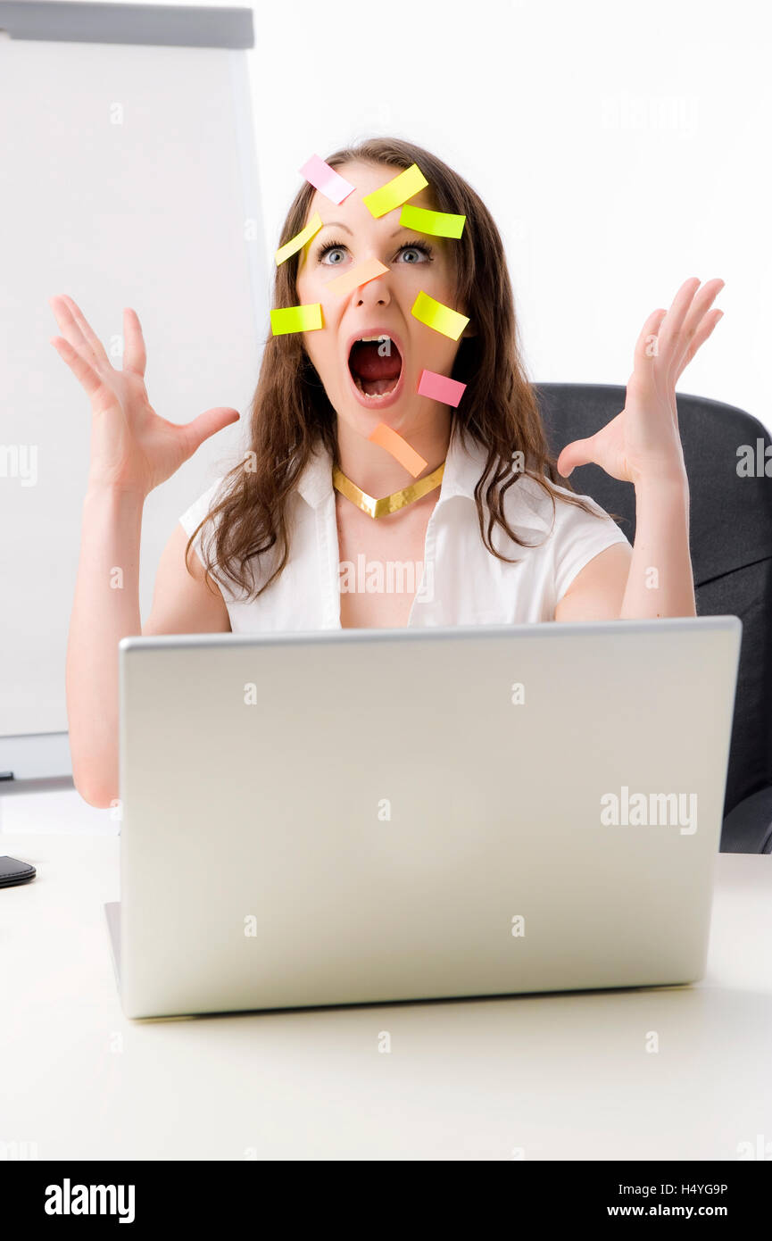 Office worker with many post-its on her face Stock Photo - Alamy