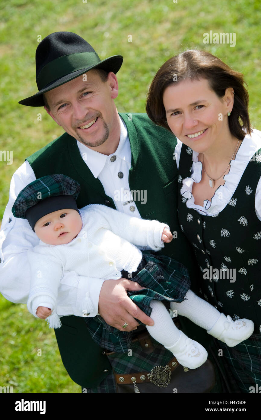 Parents and baby in traditional costume Stock Photo - Alamy