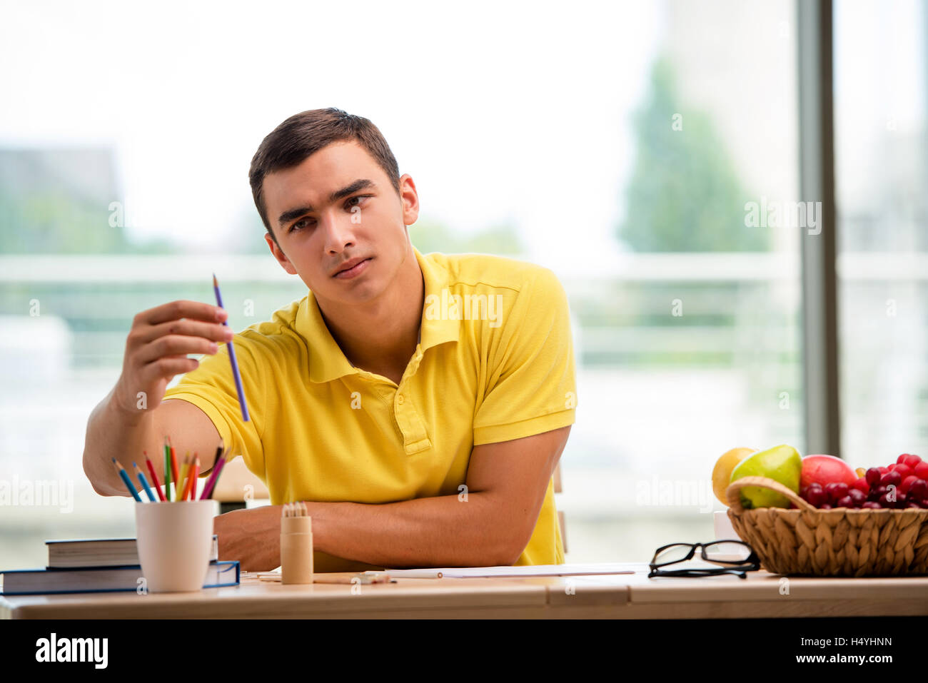 Young man drawing pictures in studio Stock Photo - Alamy