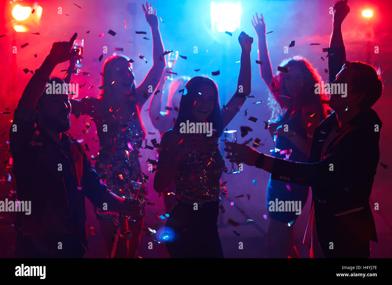 Ecstatic people having party in night club Stock Photo - Alamy