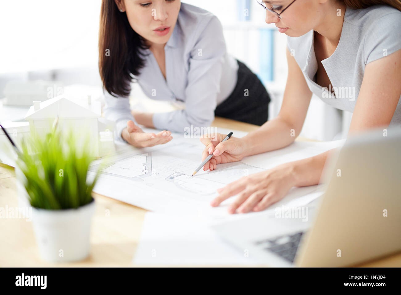 Female architects making sketch of construction Stock Photo - Alamy
